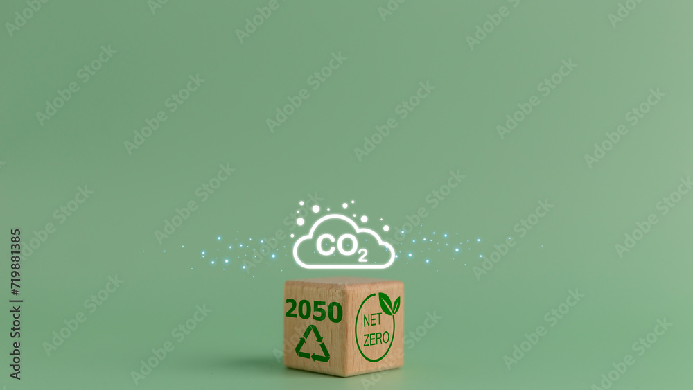Wooden cube with the symbol of CO2 emissions. Net zero by 2050. Carbon ...