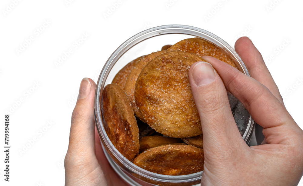 Podjadać ciastka, sięgać po okrągły herbatnik z cukrem w pudelku Stock ...