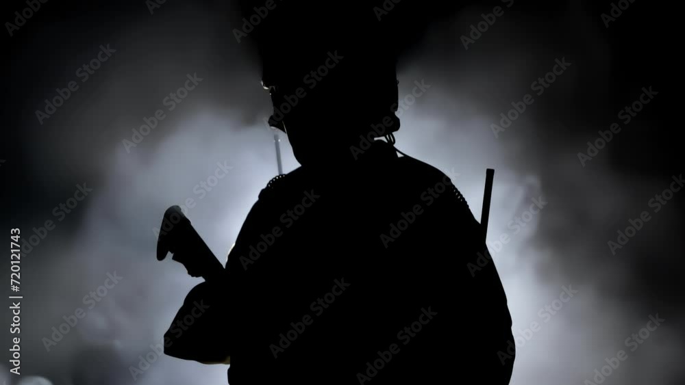 Vidéo Stock Military soldier in army camouflage stands, silhouette ...