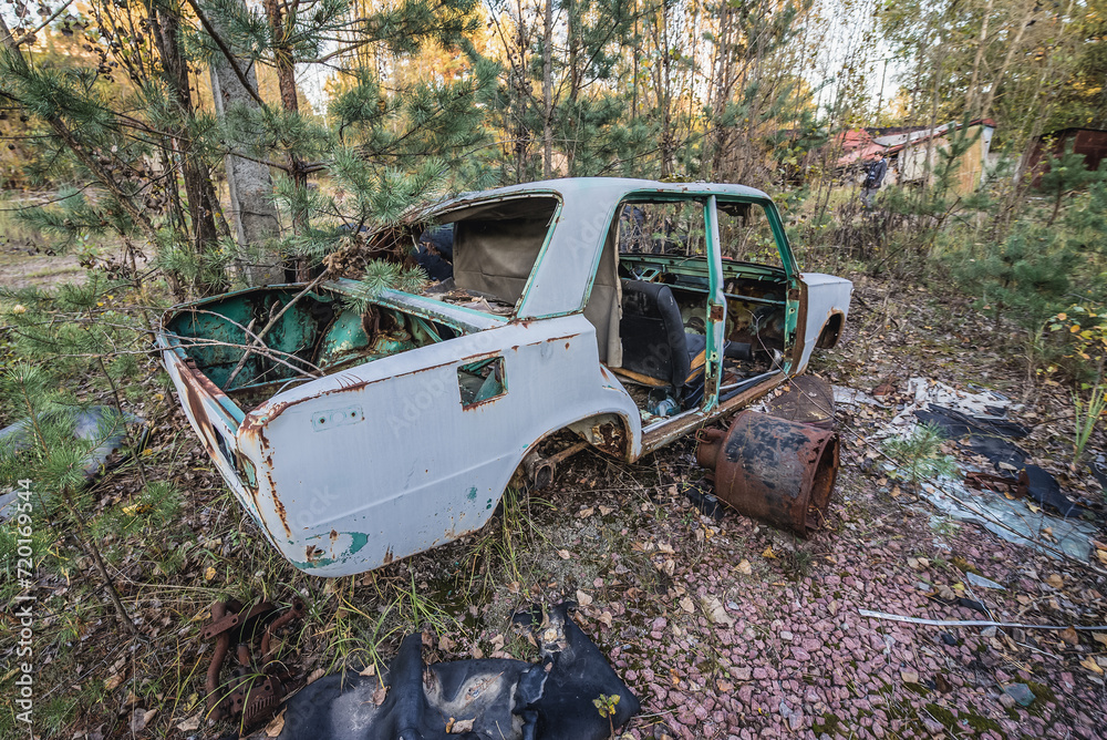Chernobyl Zone, Ukraine - October 1, 2014: Old car next to abandoned ...