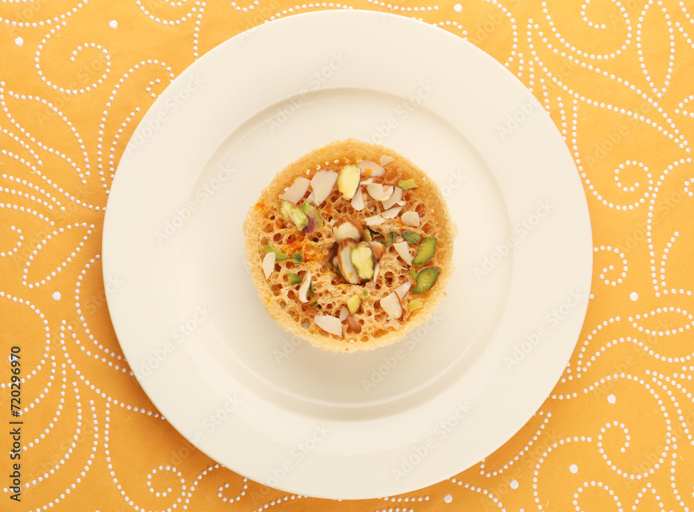 Indian Rajasthani crunchy sweet dish called Ghevar or Ghewar is an made ...