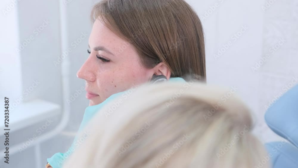 Examination by a surdologist of the outer ear, the auditory canal using ...