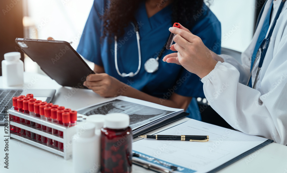 Doctor team, analysis the blood test examination results and medication ...