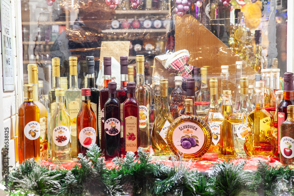 Picture of various rakijas displayed In Belgrade, in a market, in ...