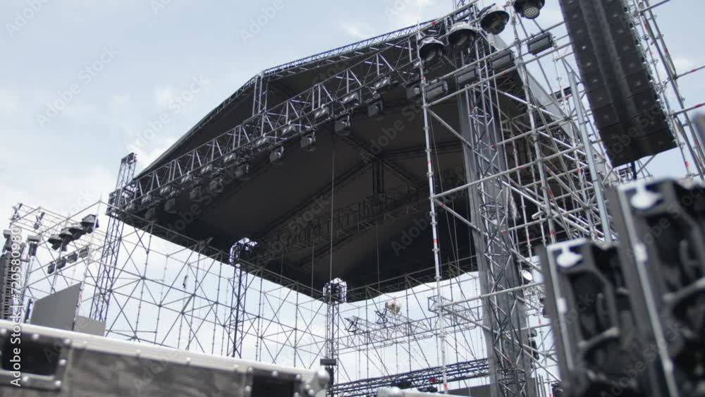 Installation of a huge stage for an outdoor concert. Large stage under ...