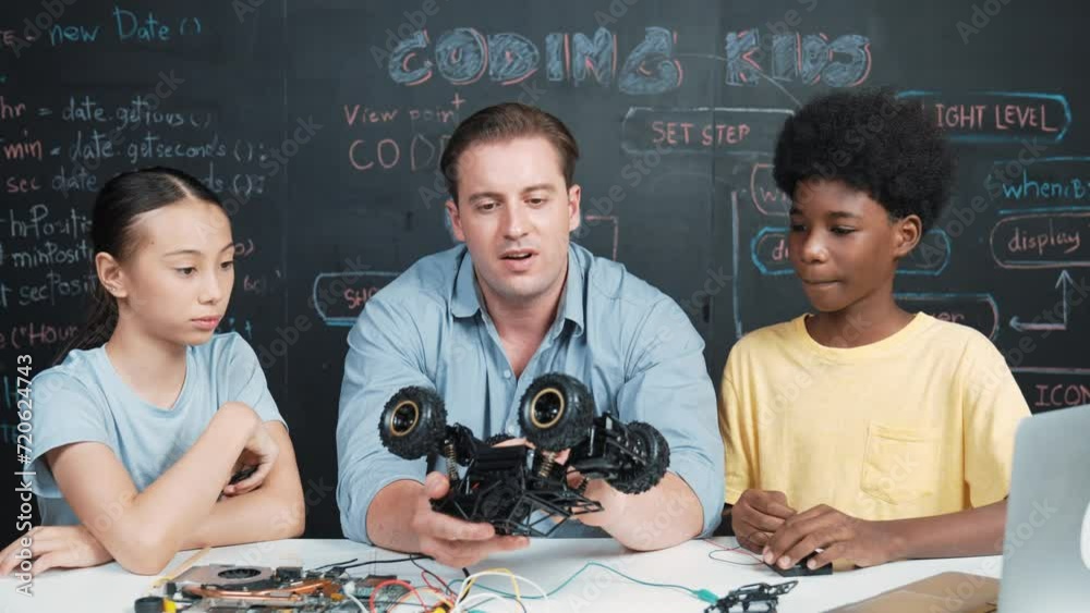 Smart teacher inspect car model construction to diverse student. high ...