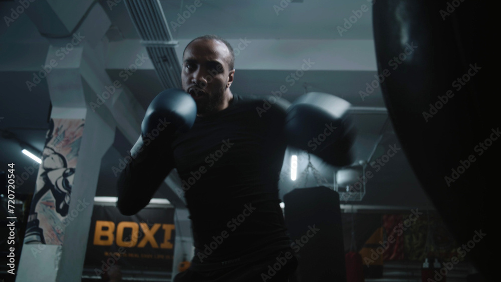 African American fighter listens coach command and starts hitting ...