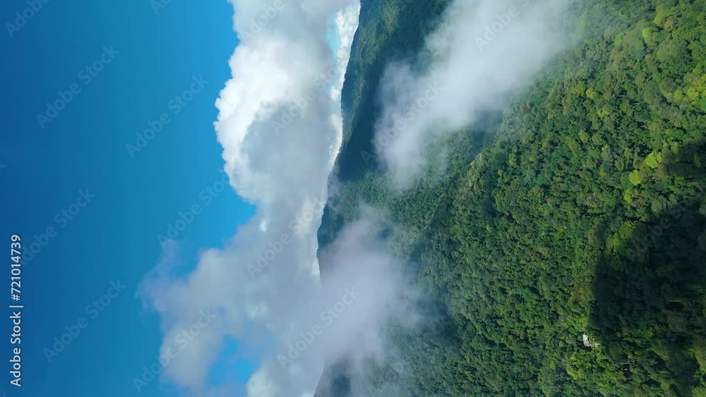 Ever Green Forest Fly through Clouds revealing Shot of Beautiful Mountain Landscape with Dense ...