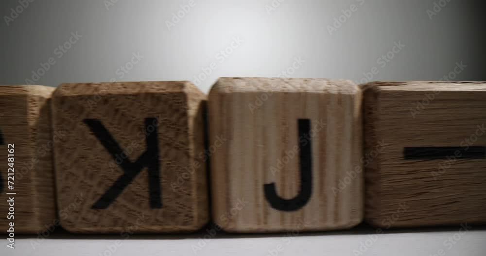 Wooden cubes with letters of English alphabet in row. Block with ...