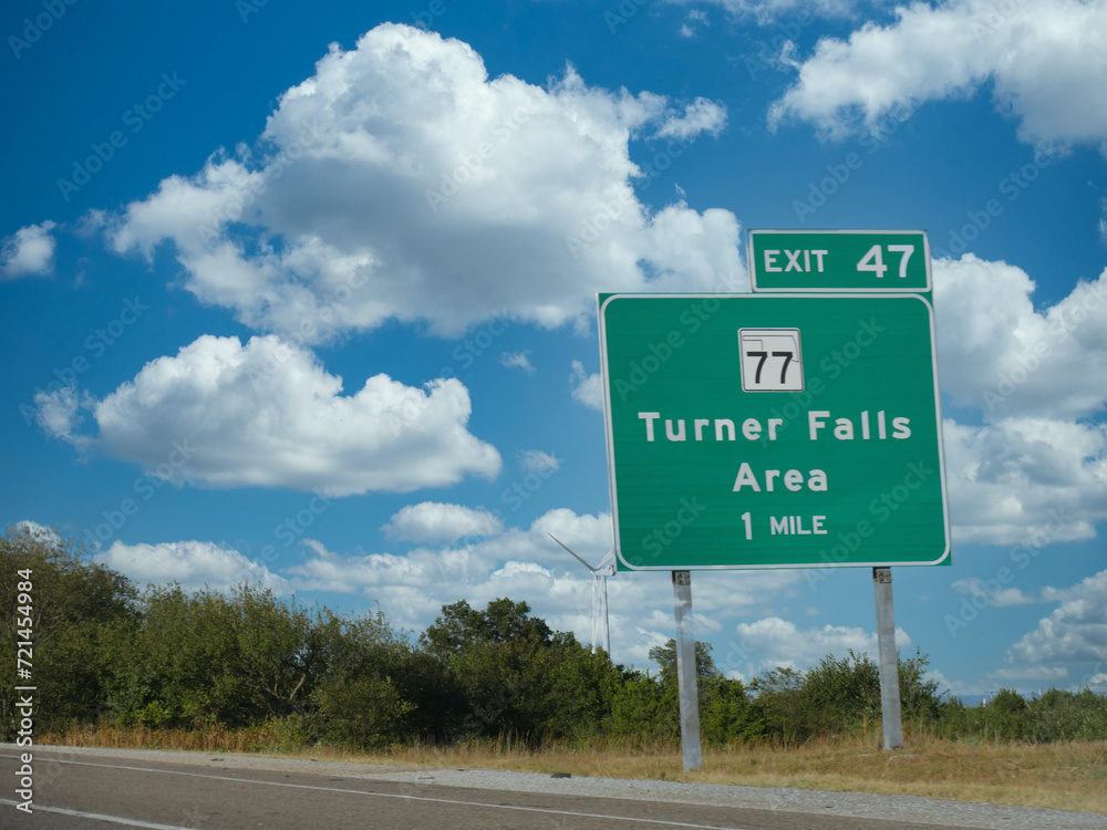 Roadside sign along Interstate 35 showing Turner Falls exit at the ...