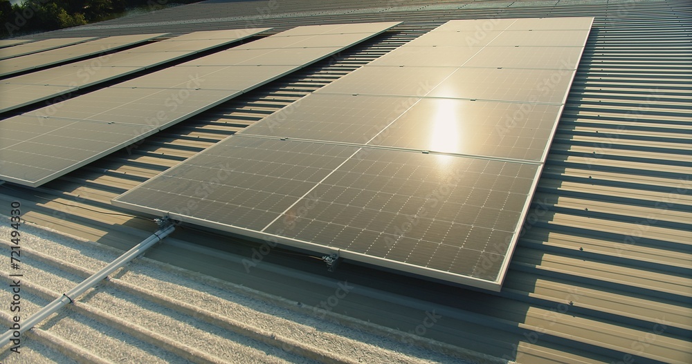 solar panels on a corrugated metal roof reflecting sunlight, showcasing ...