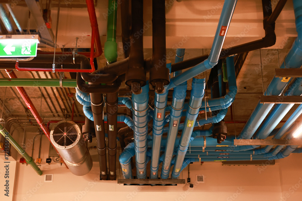 Close-up water piping and cooling piping system on rooftop of building ...