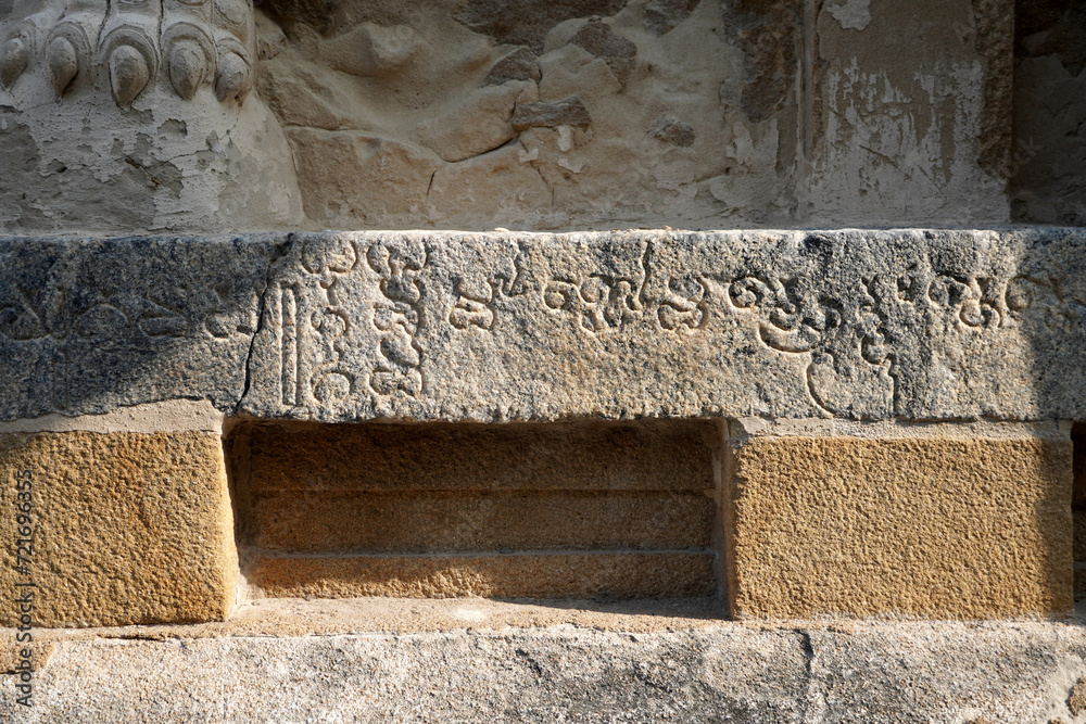 Inscriptions of Tamil language carved on the stone walls at ...