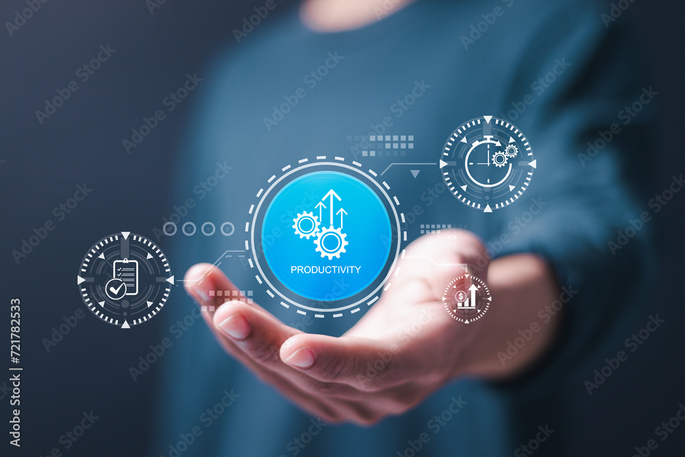 Process to increase productivity concept. Businessman holding virtual productivity icon for ...