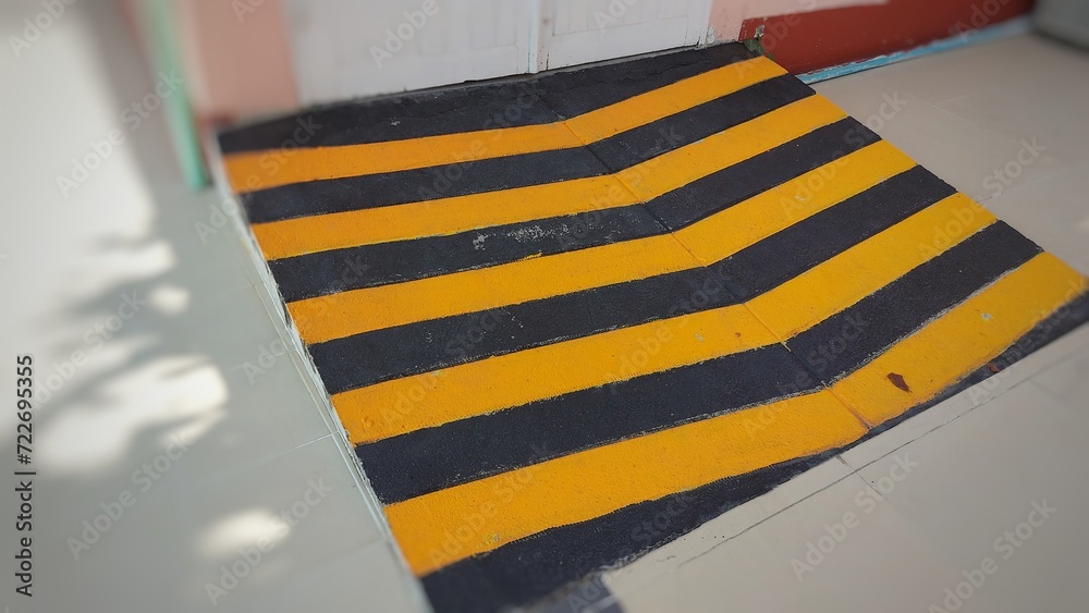 Alternating yellow and black diagonal signs indicate that no ...