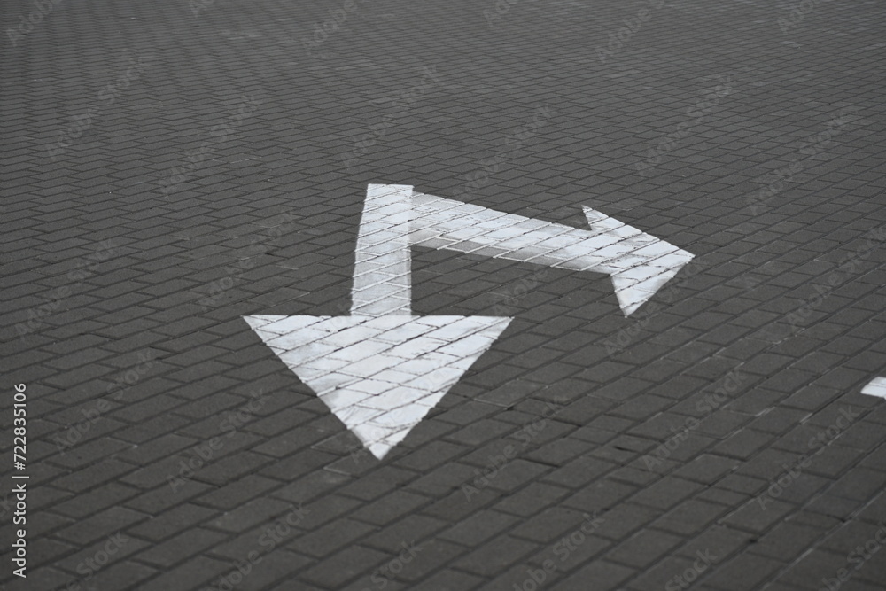 white arrow on gray asphalt, turn left, turn right, abstract white ...