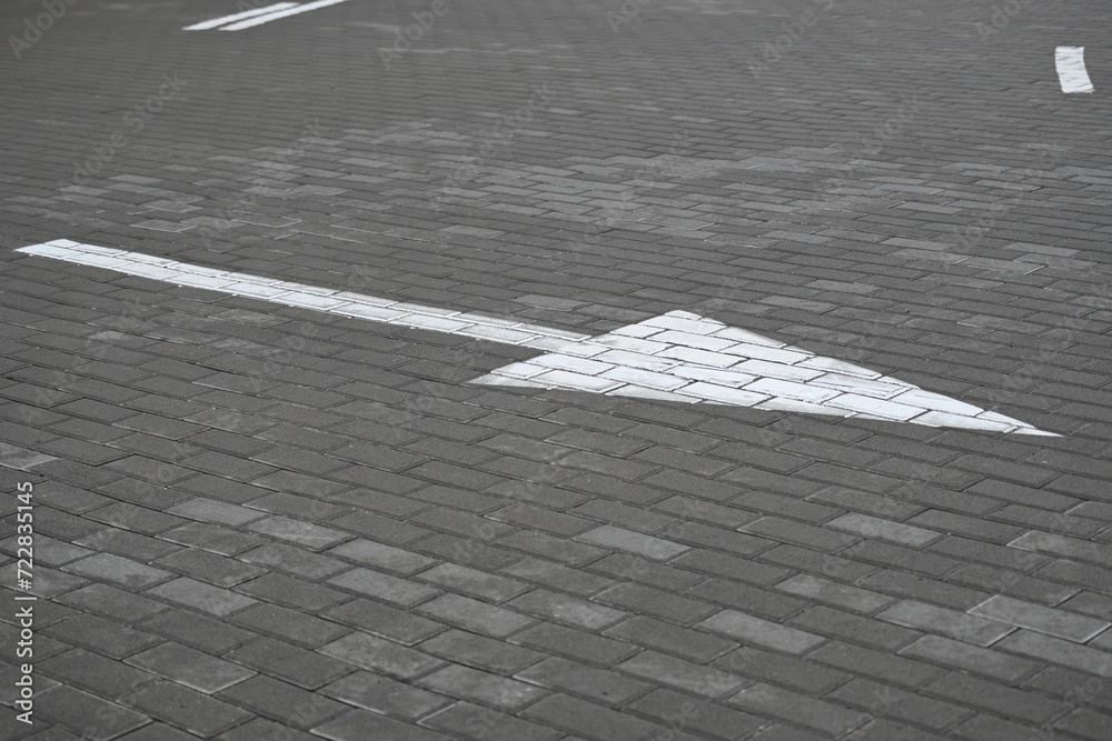 white arrow on gray asphalt, turn left, turn right, abstract white ...