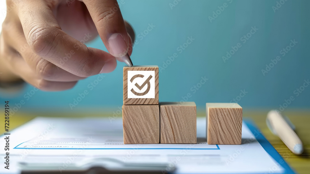 Hand holding white correct sign mark on blue wooden block cube and the ...