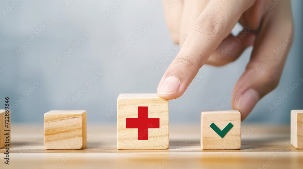 Hand holding white correct sign mark on blue wooden block cube and the ...