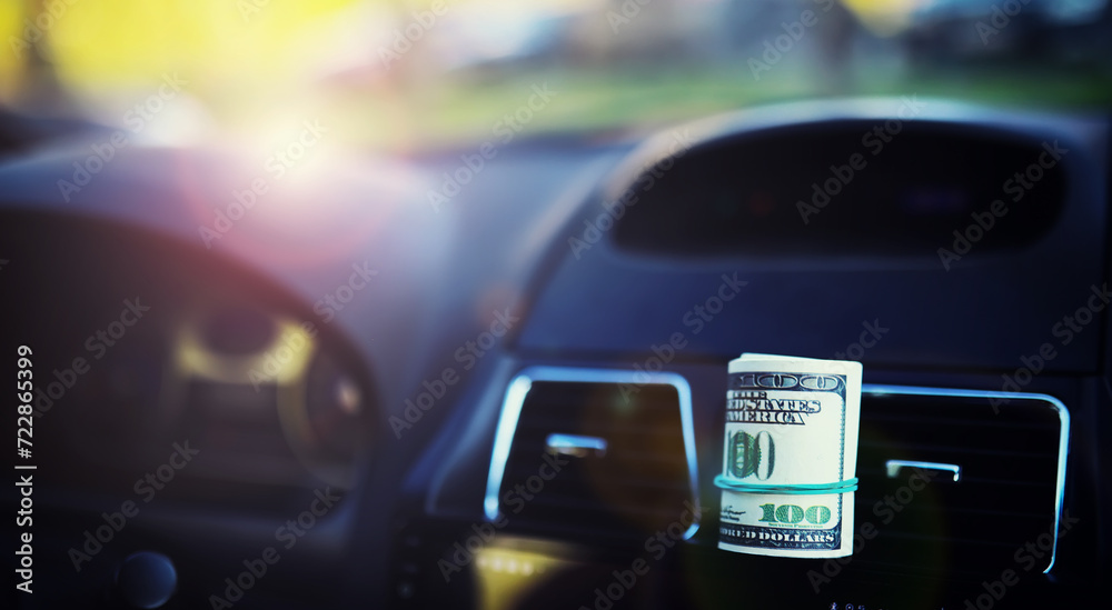 Concept background. dollars with a car key lie in inside cars ...