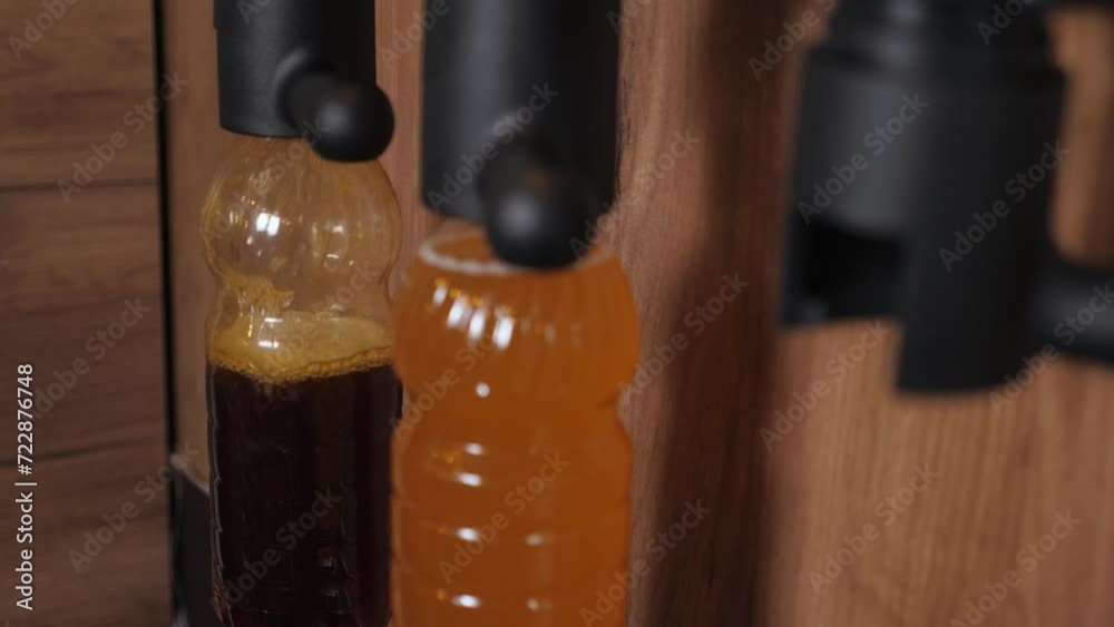 A bar counter with draft beer. Draft beer in plastic bottles. Dark beer ...