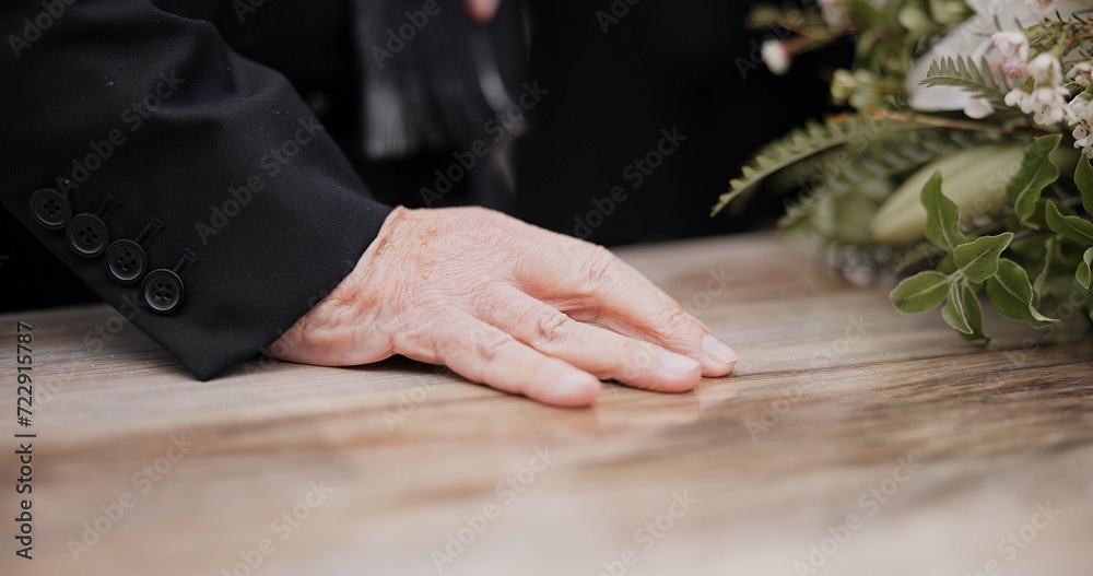 Death, funeral and hand on coffin in mourning, family at service in ...