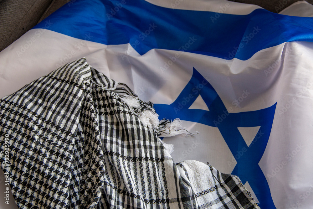 Israel flag and Palestinian scarf together lying on a rope to dry after ...