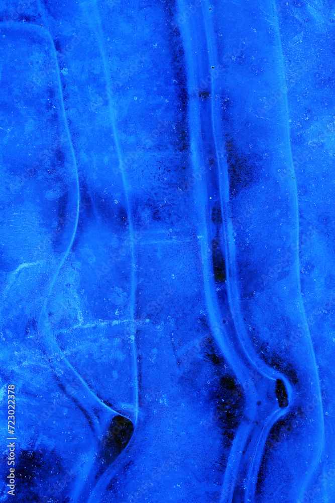 Deep blue grooves in ice, flowing like a river, capturing the dynamic ...