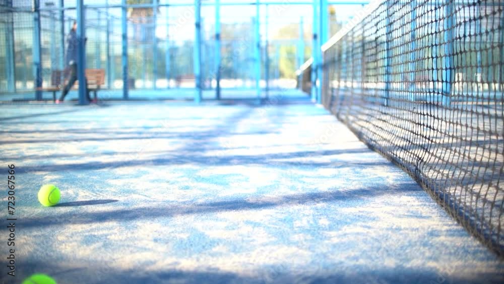 Padel court, ball, net and empty field close-up view in slow motion ...