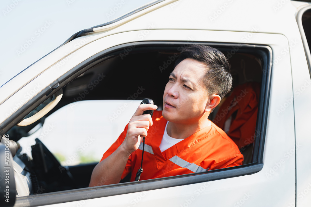 Asian male EMS paramedics or emergency medical technicians in orange ...