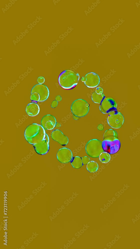 Vertical Transparent animated drops, water bubbles, liquids on a ...