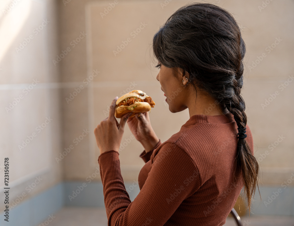 multiracial woman, eating fast food, outdoor food eating woman ...
