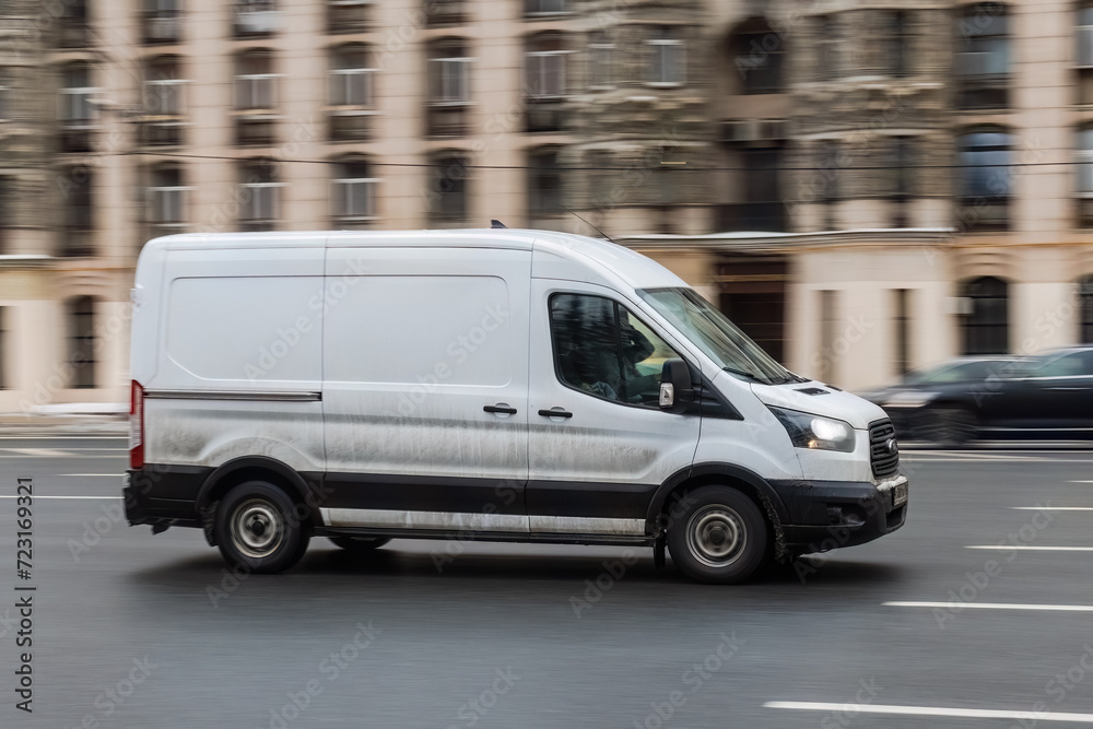 Ford Transit Fourth generation in the city street. Side view of white ...
