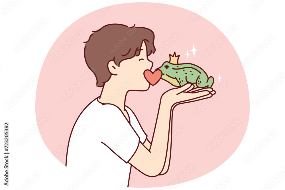 Guy kisses frog princess with crown on head, wishing that animal turned ...