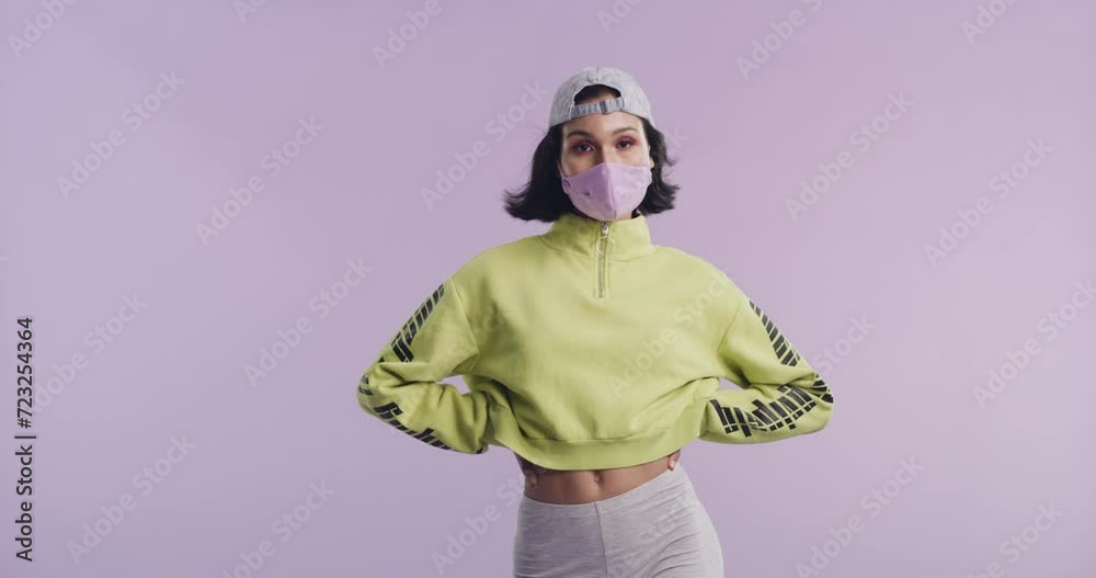 Face mask, style and cool woman with fashion in studio, purple ...
