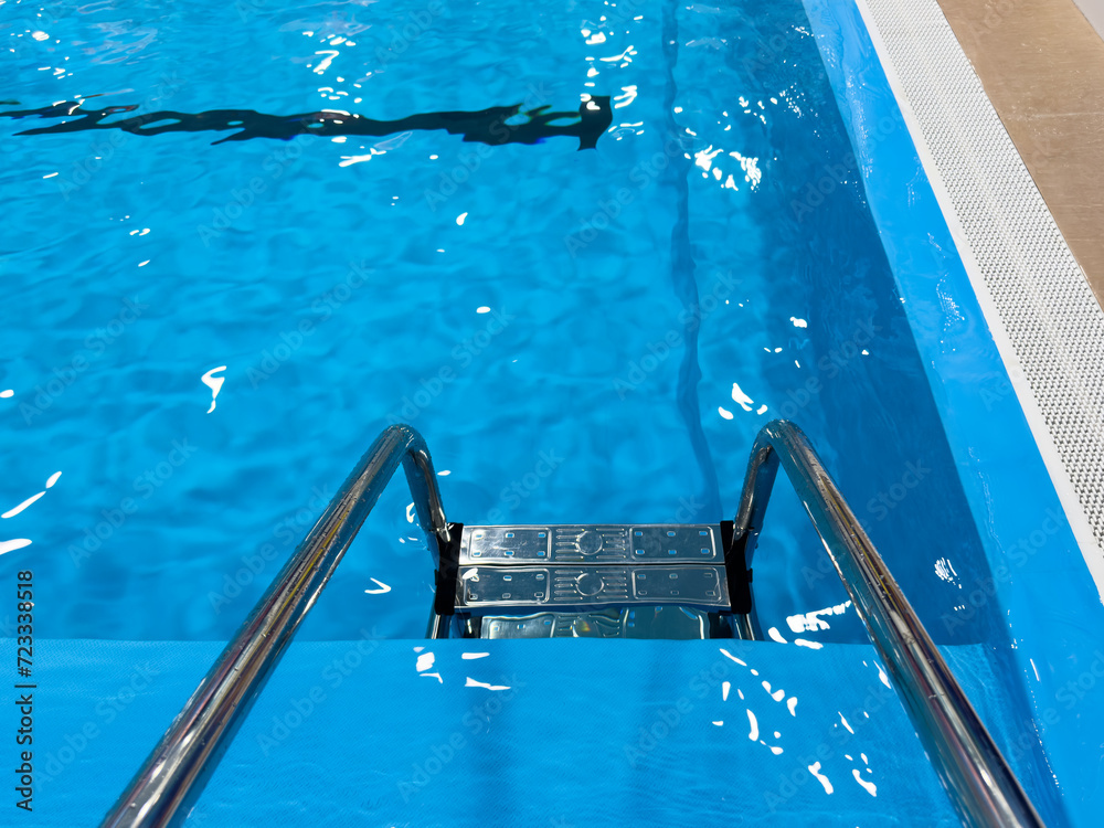 Swimming pool with stair and water. Swimming pool with handrail ...