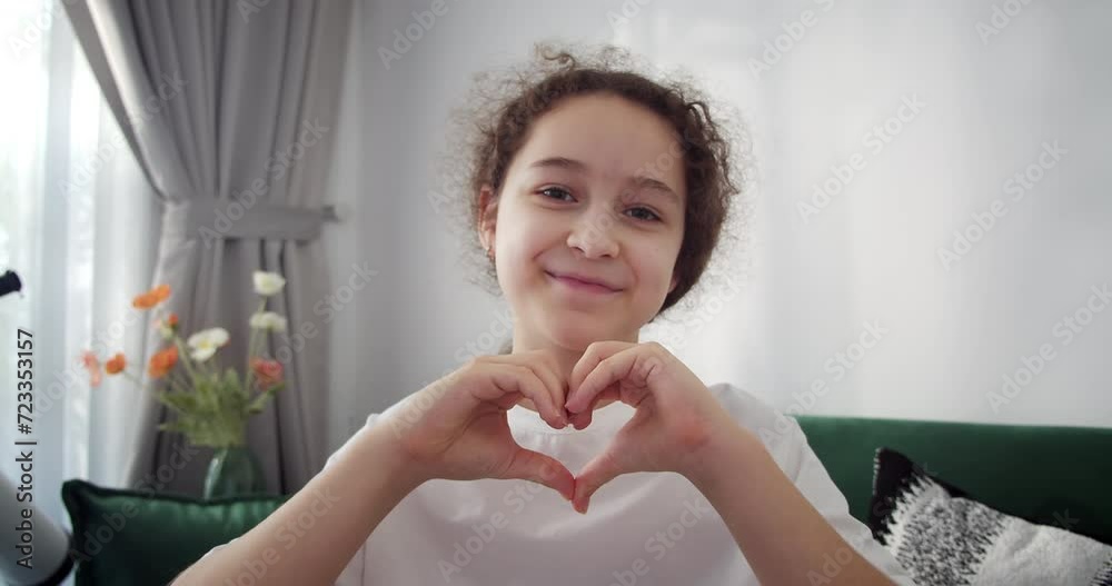 Beautiful happy little cute child face adorable girl kid seen through ...