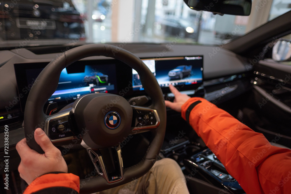 man in car driving BMW i5 eDrive40, digital panel, Interior, cockpit ...