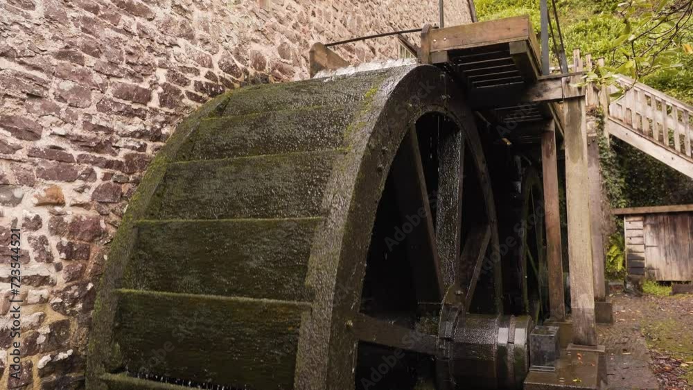 Close up on a section of hydraulic wheel from a water mill. Camera on ...