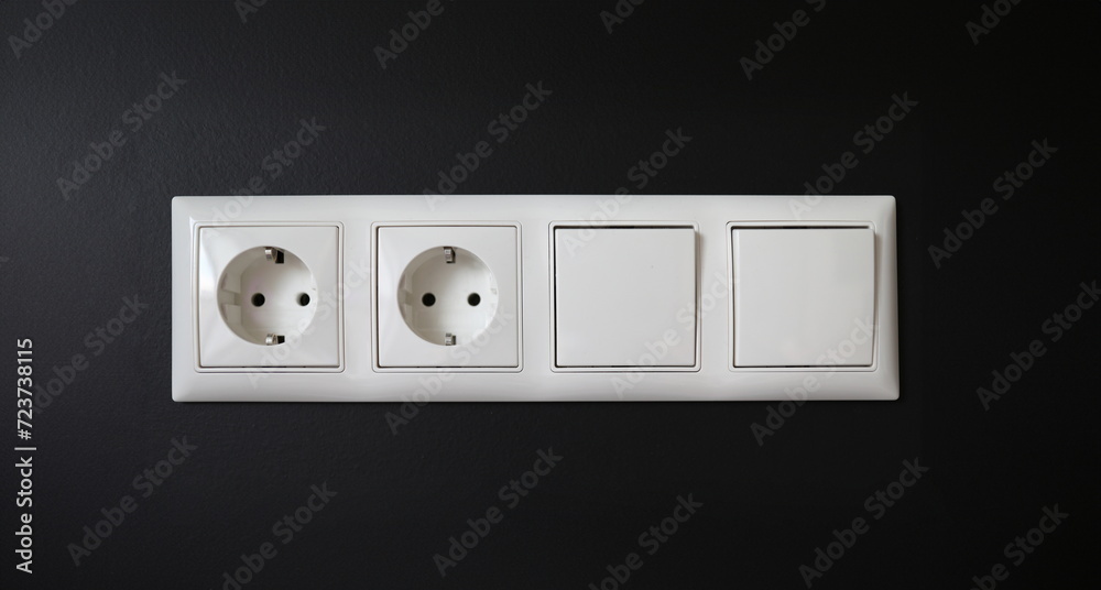 Integrated socket with switches installed in wall. Device is used to ...