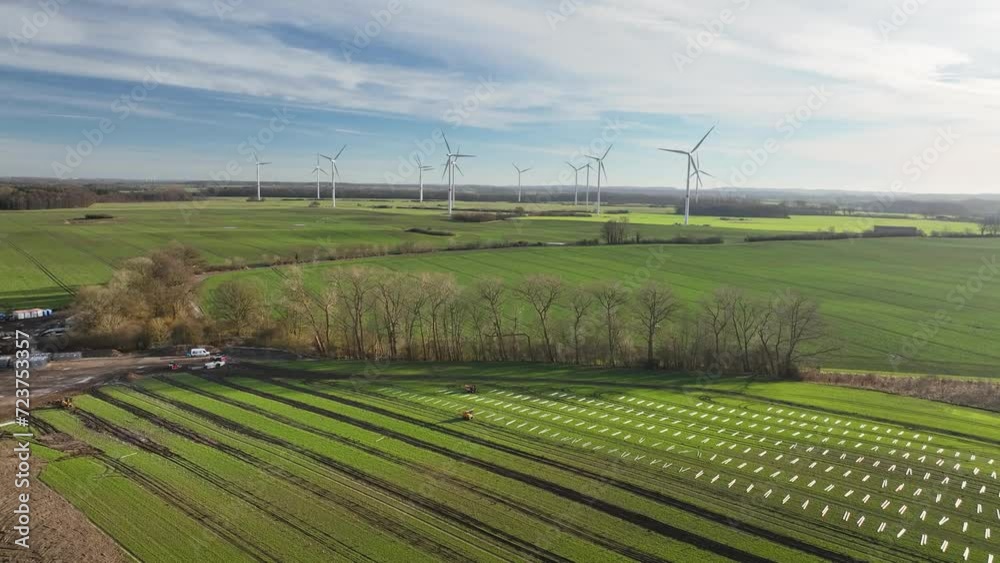 Footage over construction site of a photovoltaic park with wind ...
