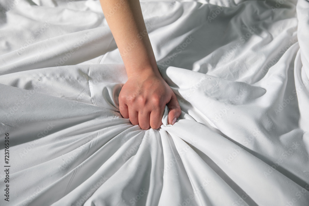 Poster Woman hand squeezing white bed sheet during orgasm. – Wall Art ...