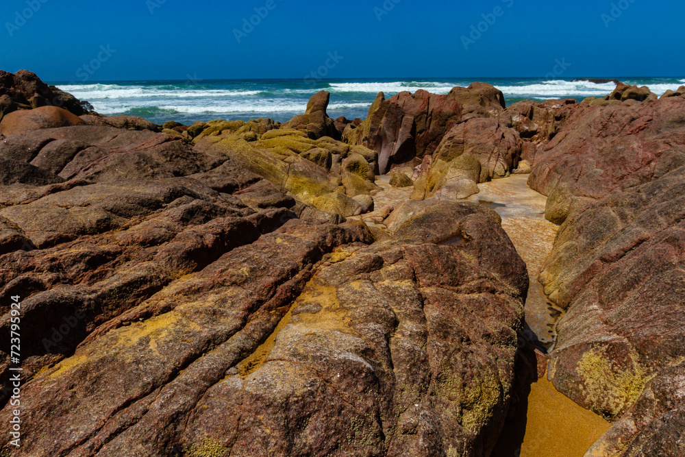 Picturesque coastal red rocks on the Atlantic Ocean coast.Legzira beach ...