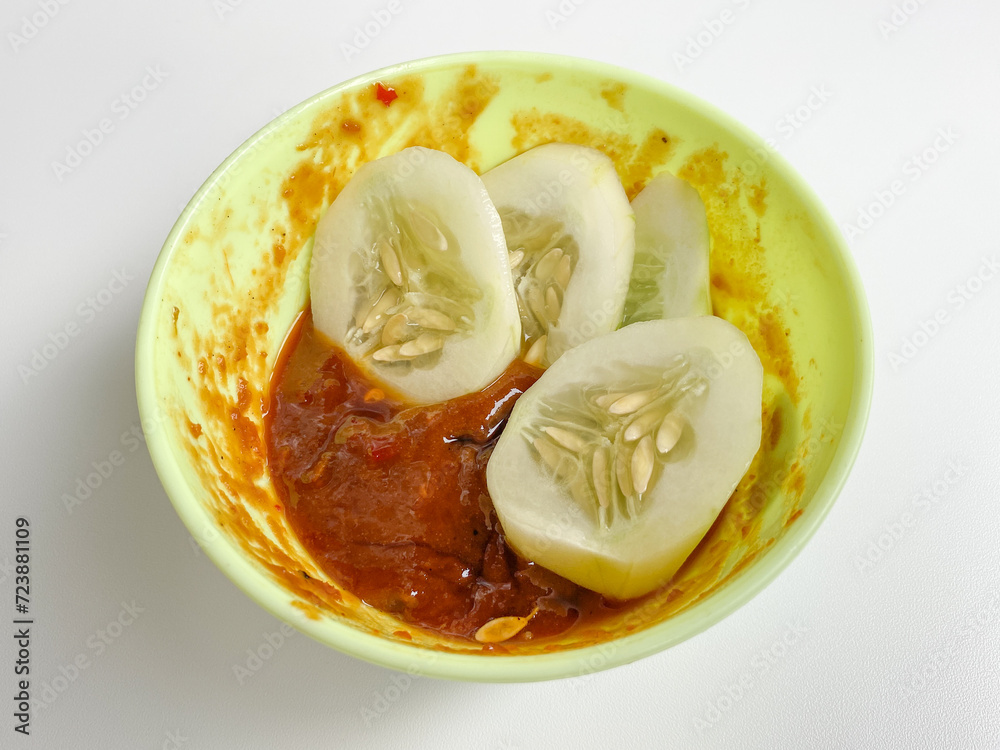 Rujak, traditional salad from Indonesia, consist of cucumber slices and ...