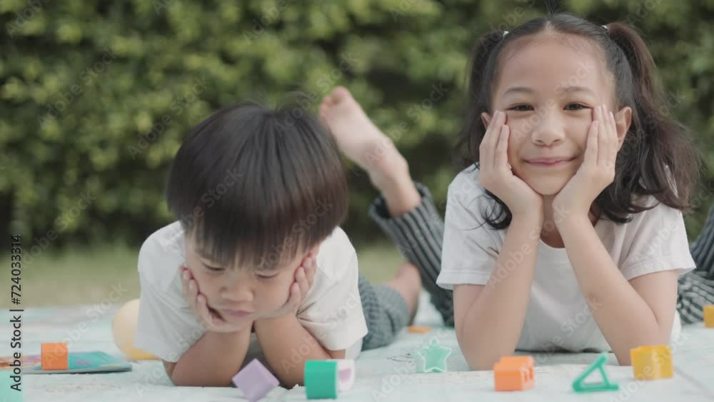 Close up smiling faces of two adorable asian kids, brother and sister ...