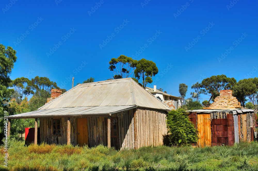 Abandoned pioneer cottage made of vertical logs and with a roof of ...