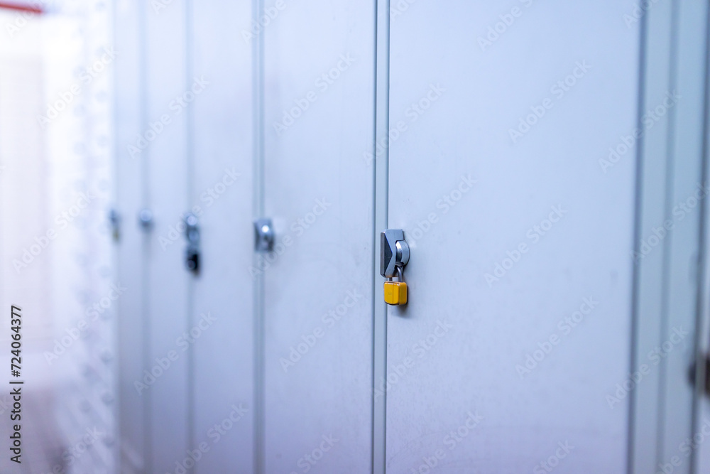 Ein Schloss hängt vor einem Spind auf Arbeit Stock Photo | Adobe Stock