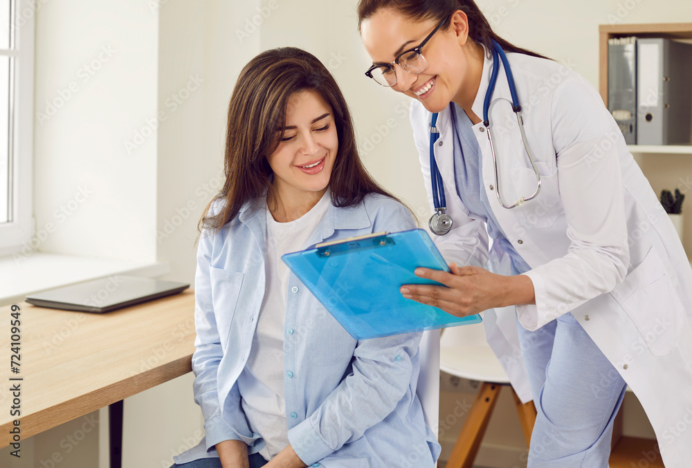 Portrait of smiling friendly doctor gynecologist wearing stethoscope ...