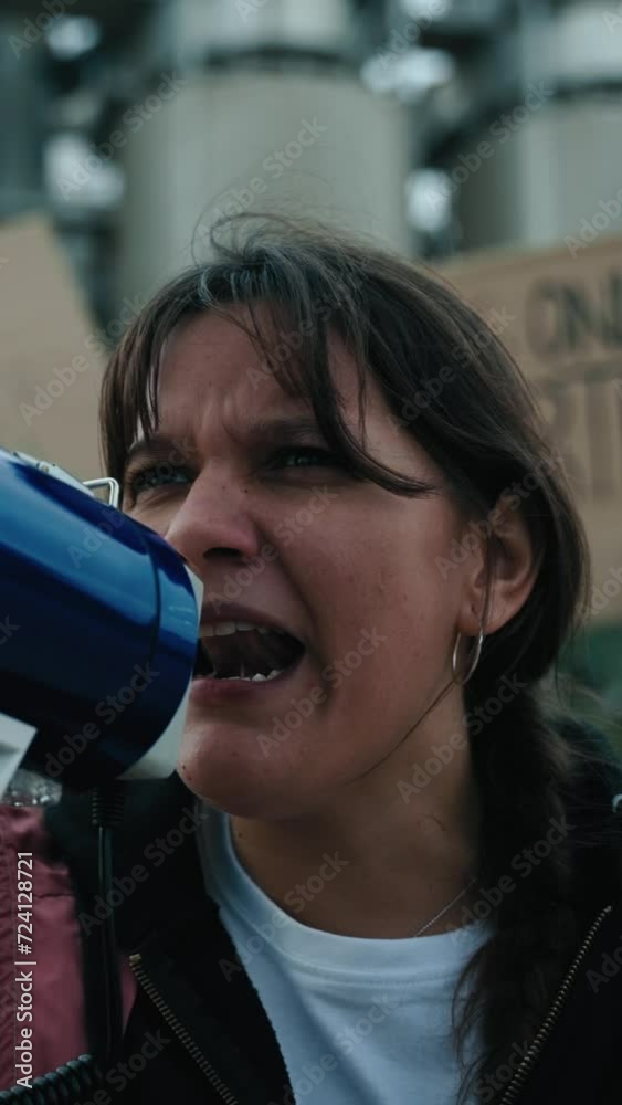 Vertical close up nonconformist gen z activist woman shouting at ...