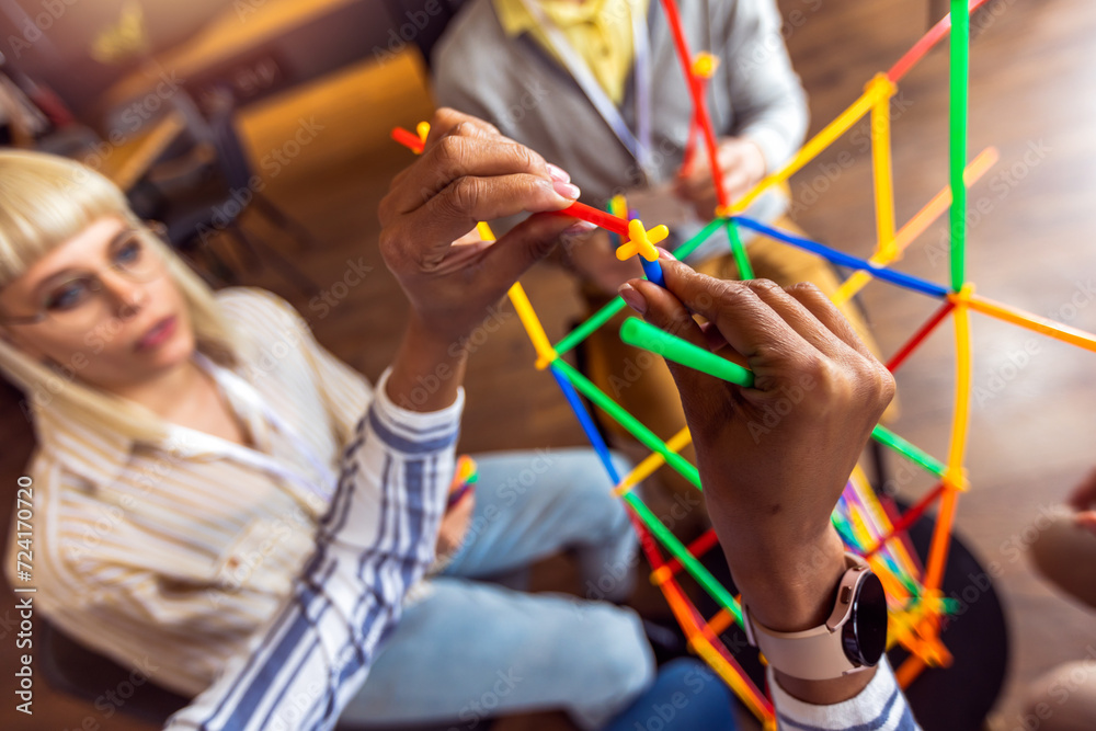 Team building activities in the office with sticks.Concept of ...